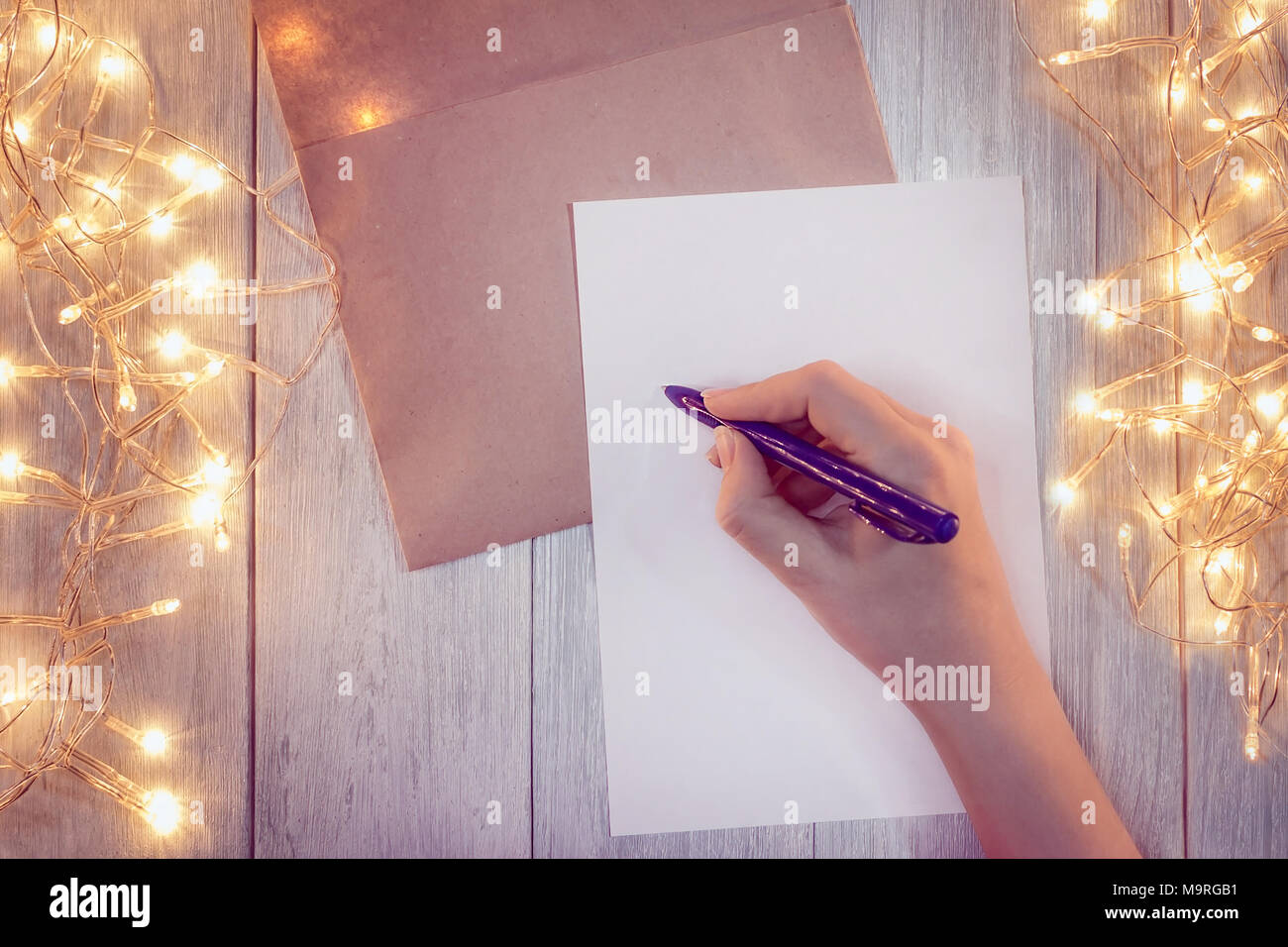female hand writing a letter Stock Photo - Alamy