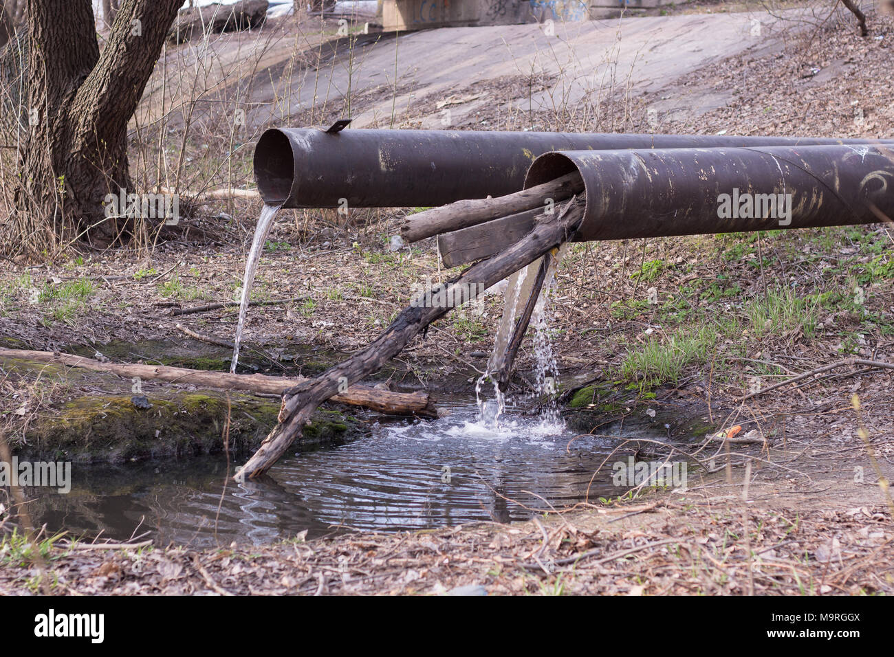 pipes pouring mud water pollution Stock Photo - Alamy