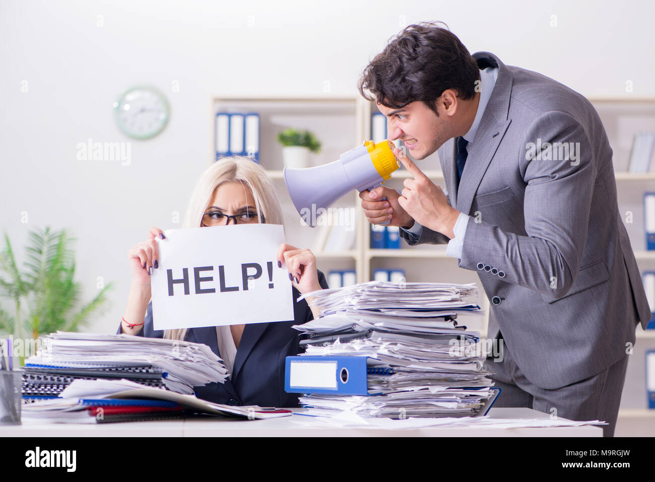 Angry boss yelling at his assistant secretary hi-res stock photography ...