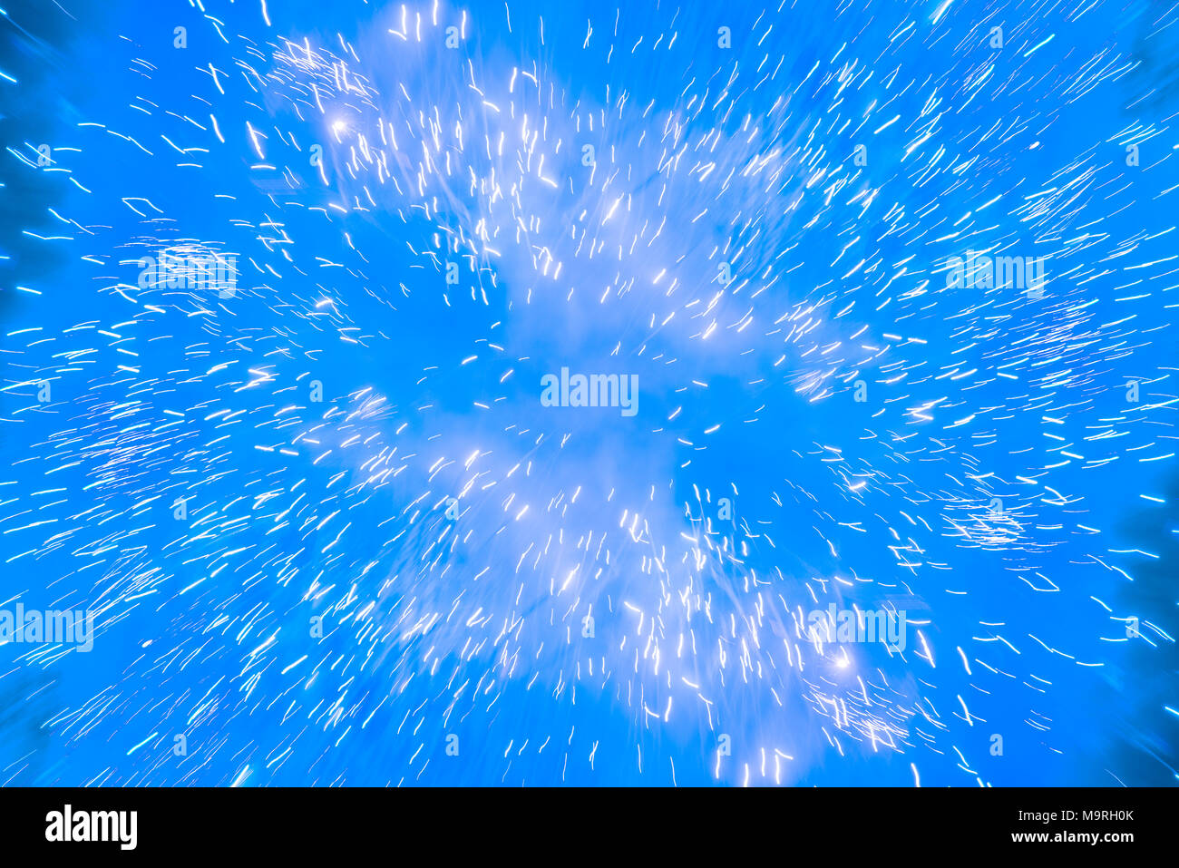 Blue burst of sparkle Stock Photo - Alamy