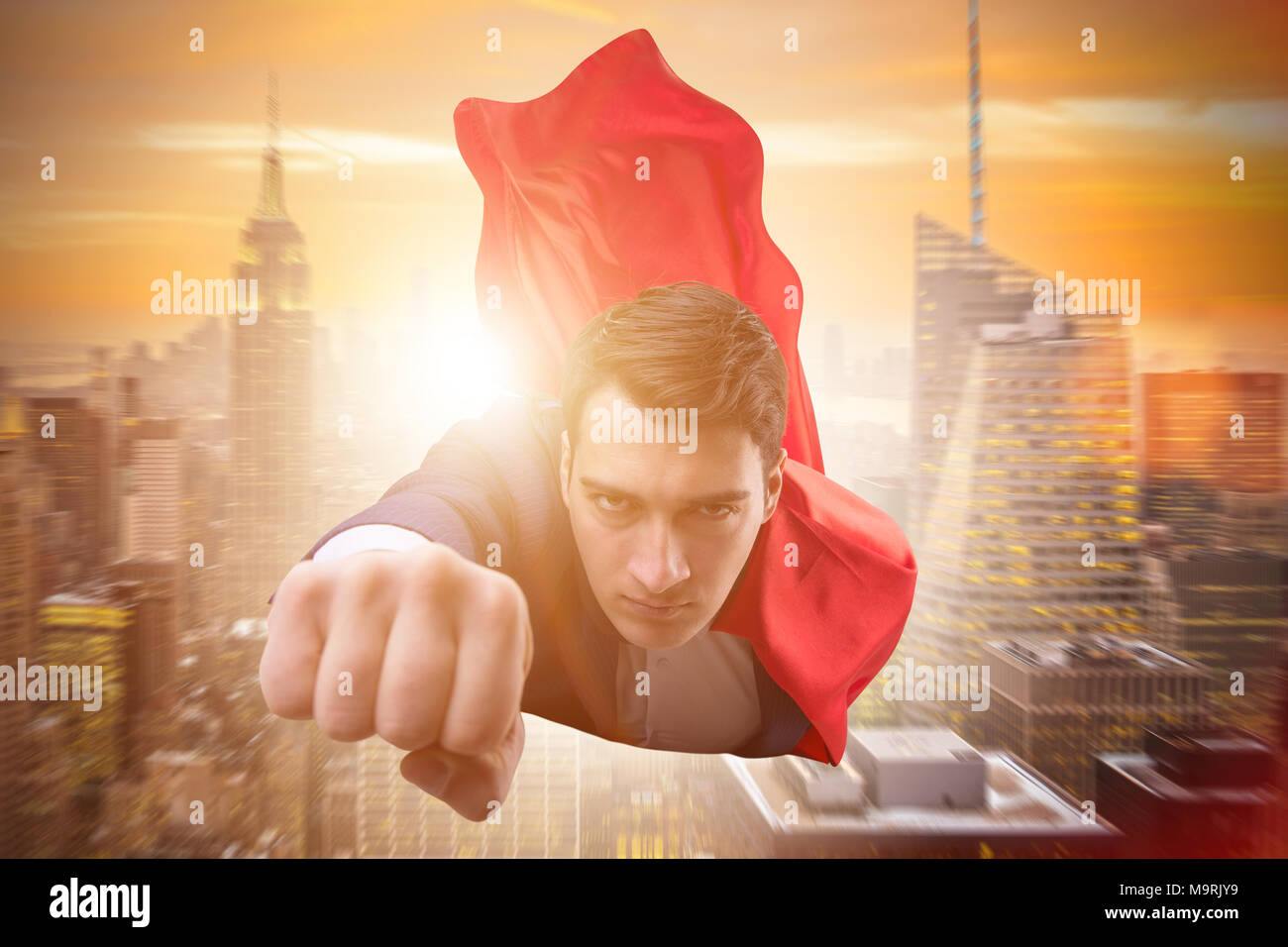 Flying super hero over the city Stock Photo - Alamy