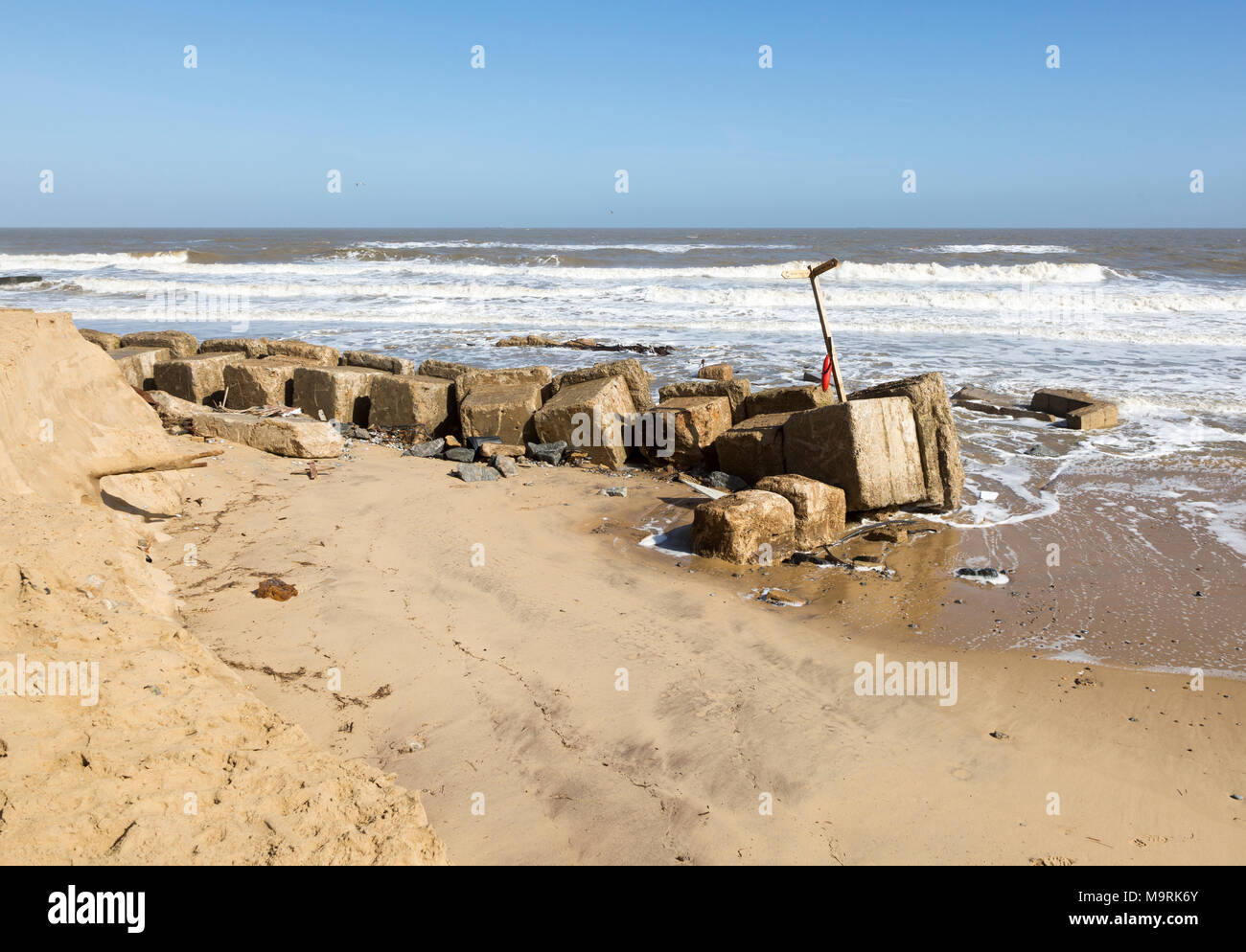 March 20 2018 Hemsby, UK. Coast path sign left abandoned by coastal ...