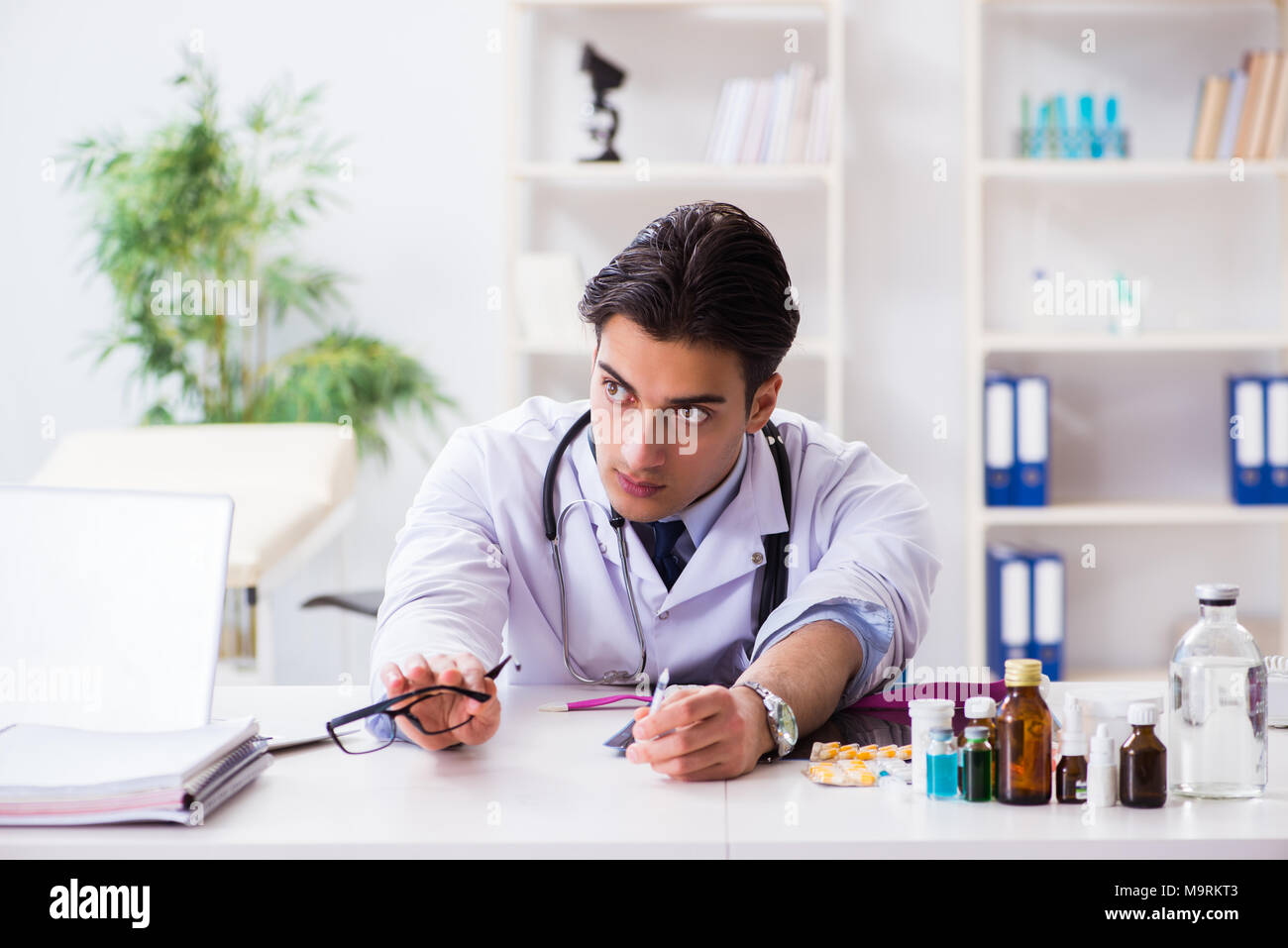 Doctor drug addict in the hospital Stock Photo - Alamy