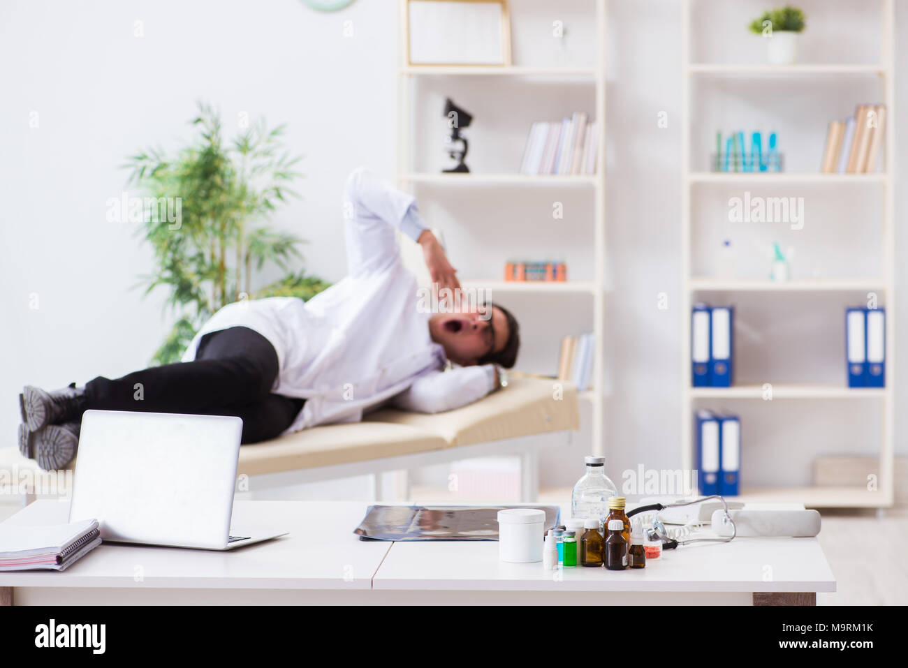 Doctor relaxing after complex surgery in hospital Stock Photo - Alamy