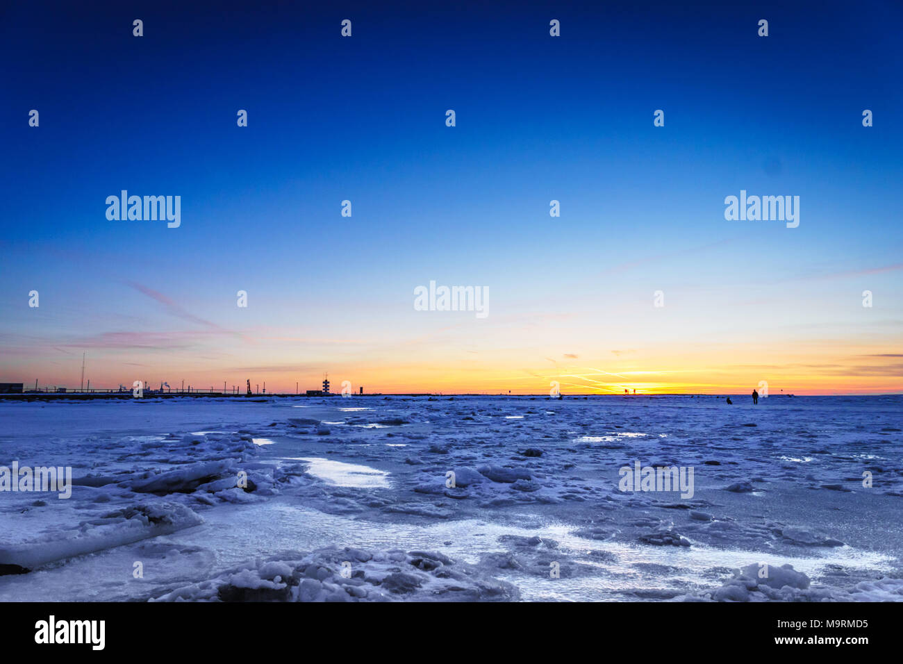 Frozen Baltic sea with snow in winter and sunset at Pirita beach in ...