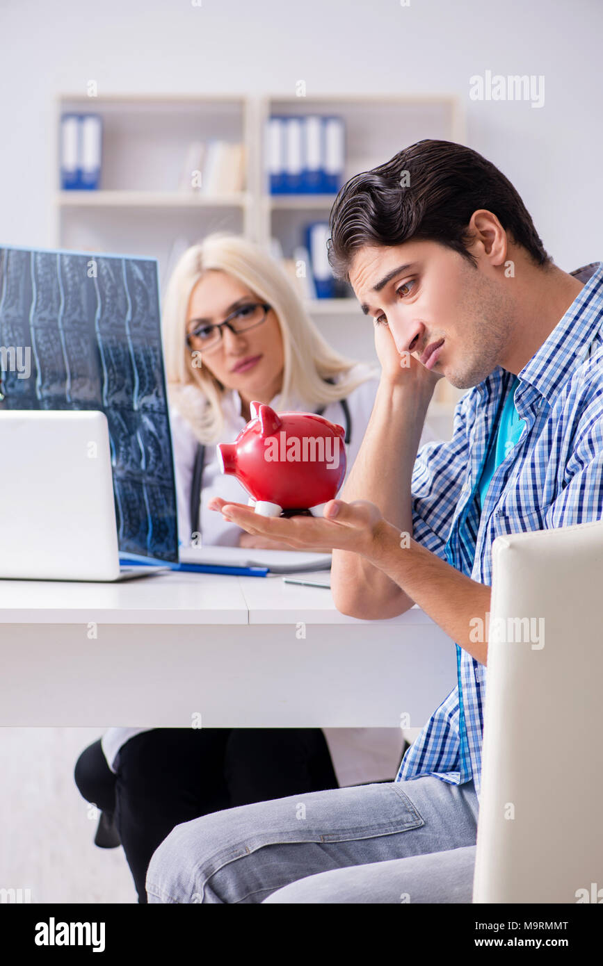 Male patient angry at expensive healthcare bill Stock Photo - Alamy