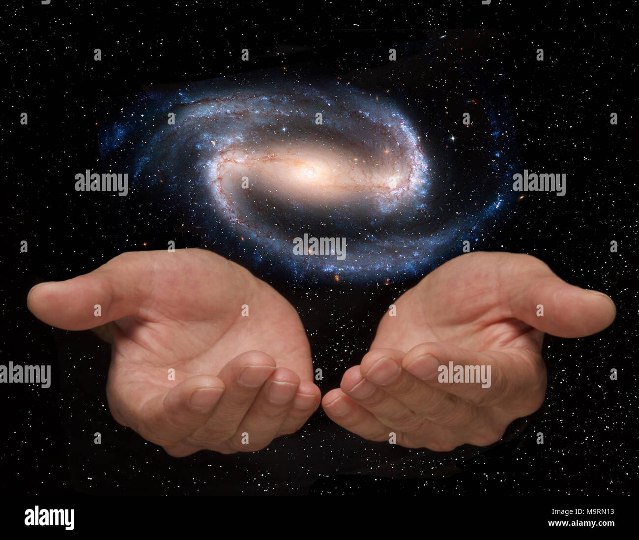 Galaxy and hands Stock Photo - Alamy
