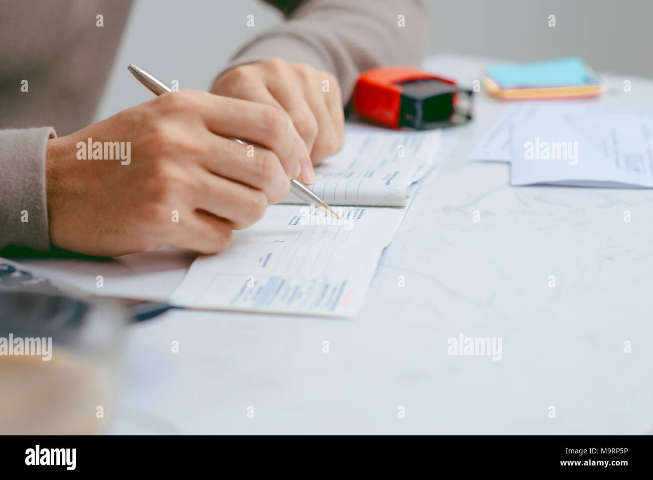 Hand writing cheque hi-res stock photography and images - Alamy