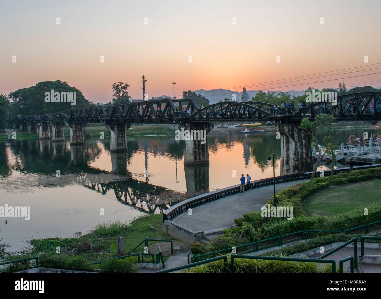 Sun setting over a bridge Stock Photo - Alamy