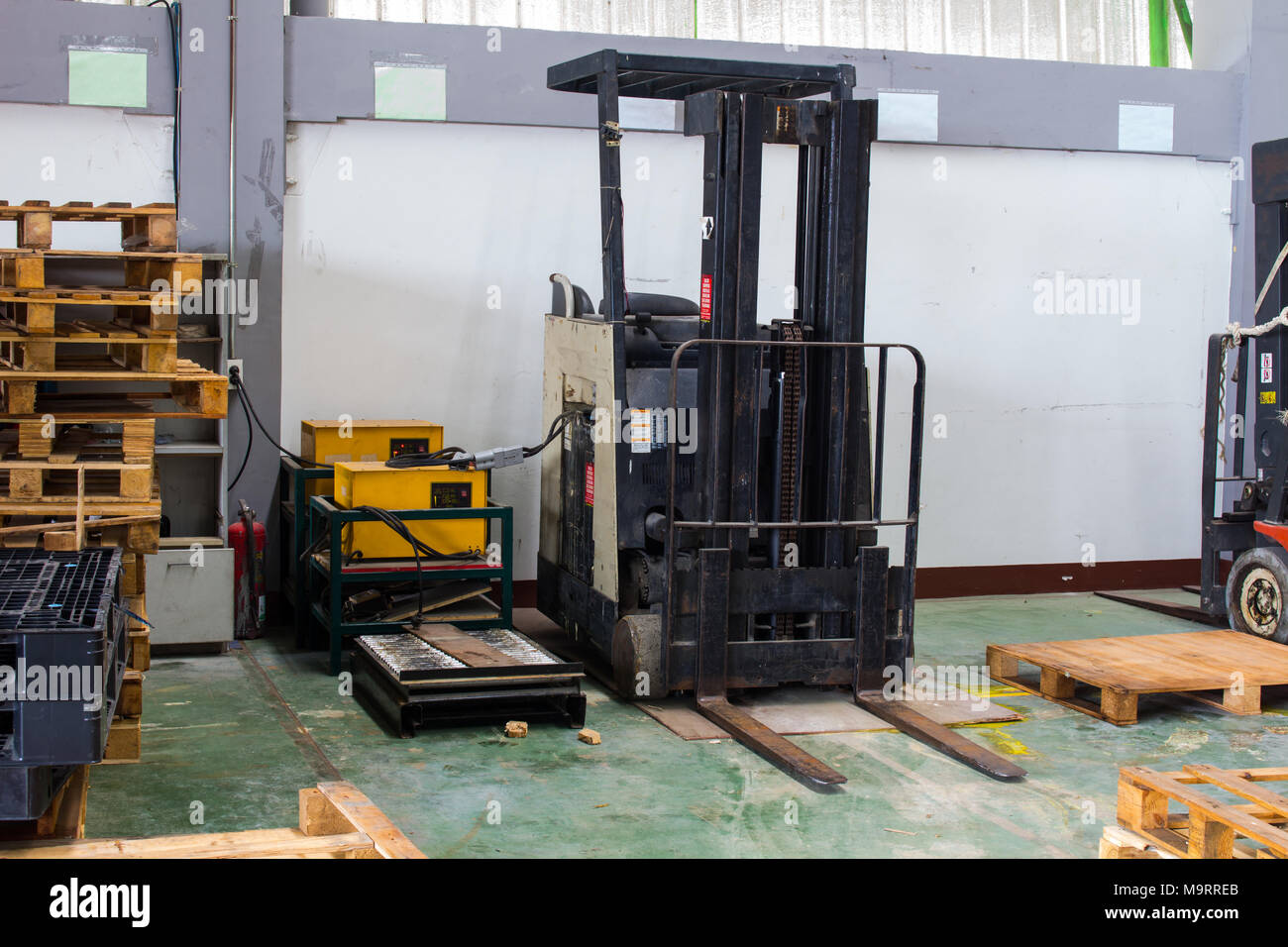 Electric Forklift charge the battery Stock Photo - Alamy