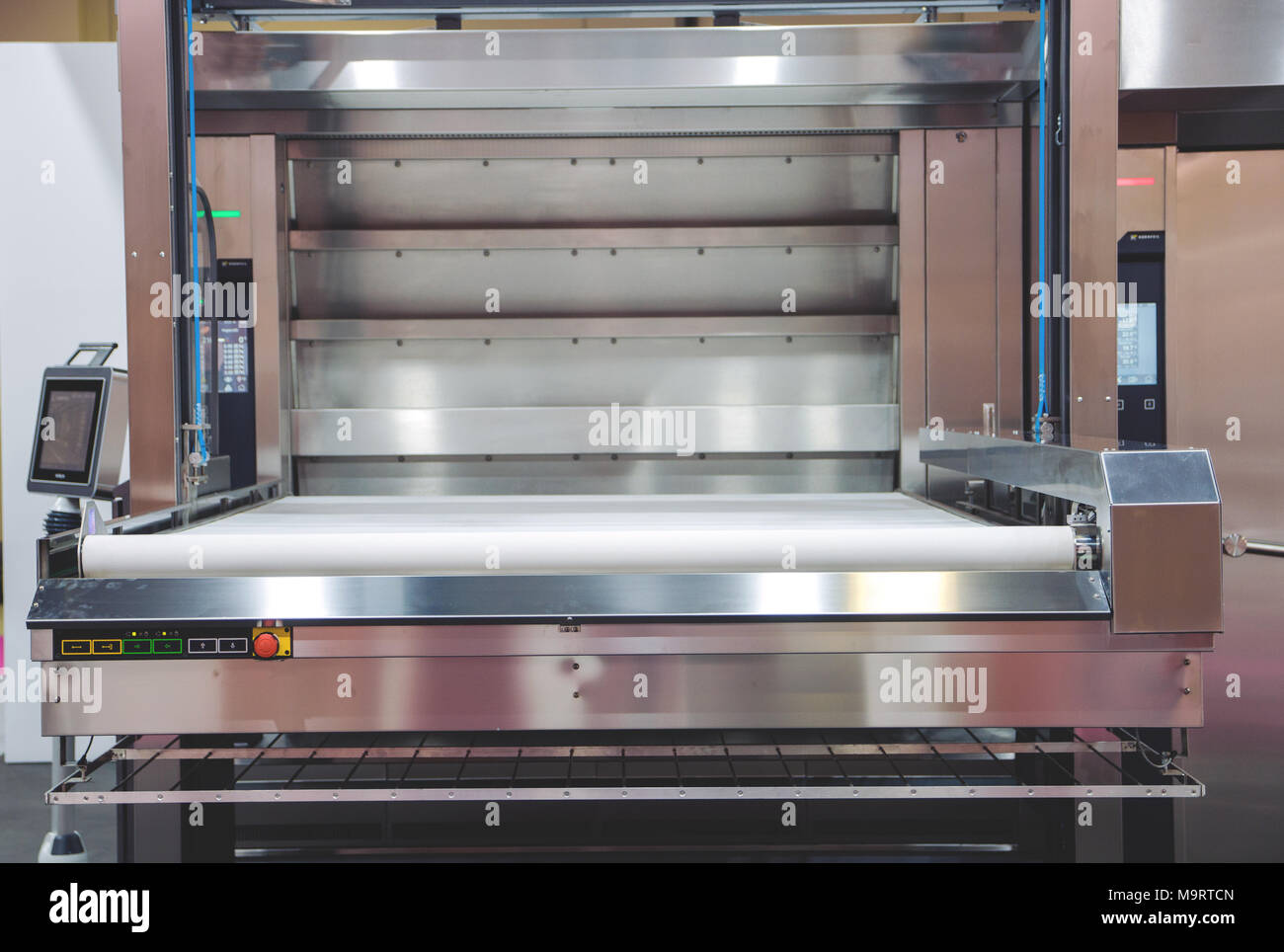 conveyor for baking bread products Stock Photo - Alamy