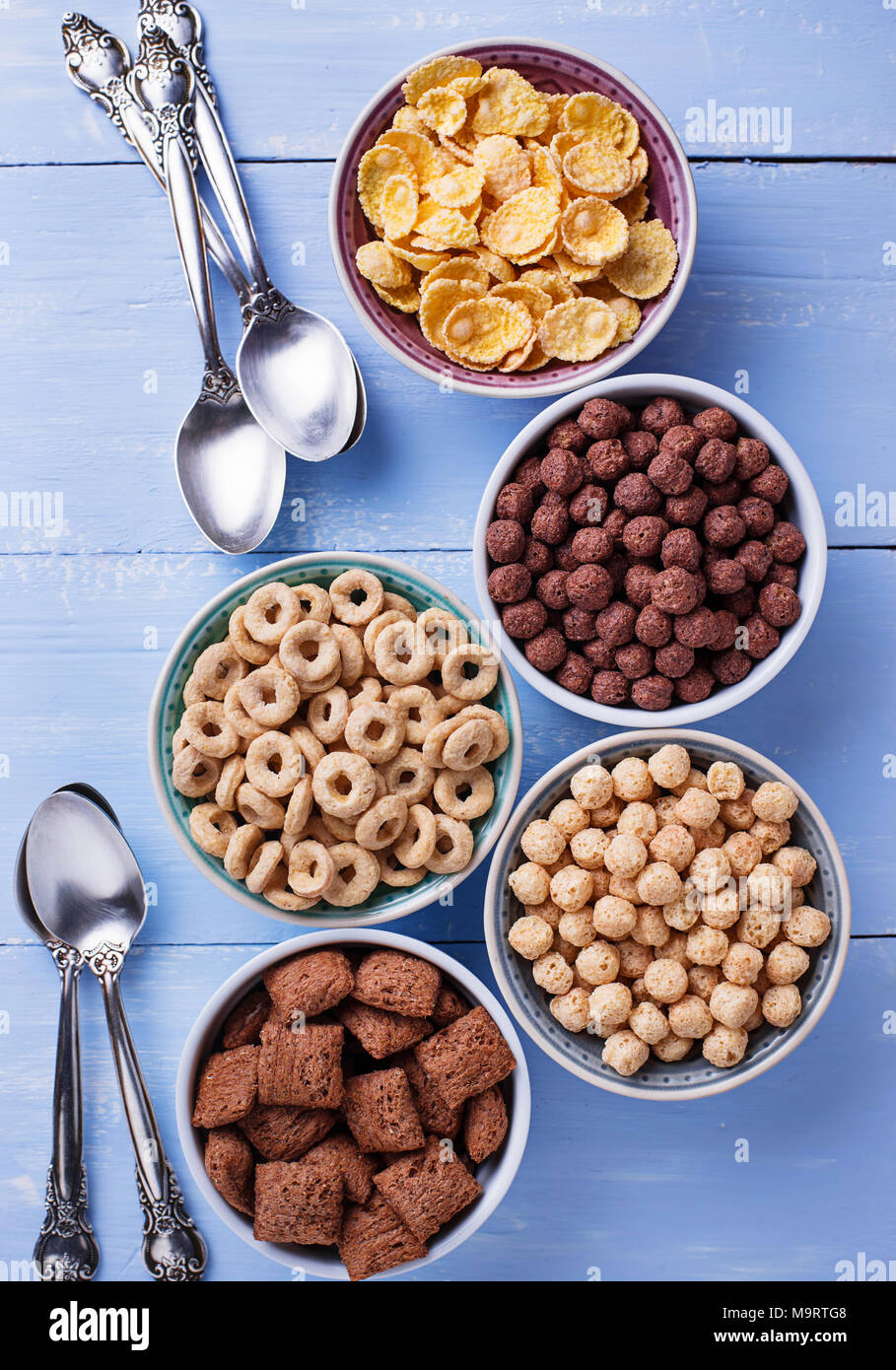 Selection of various corn flakes for breakfast. Top view Stock Photo ...