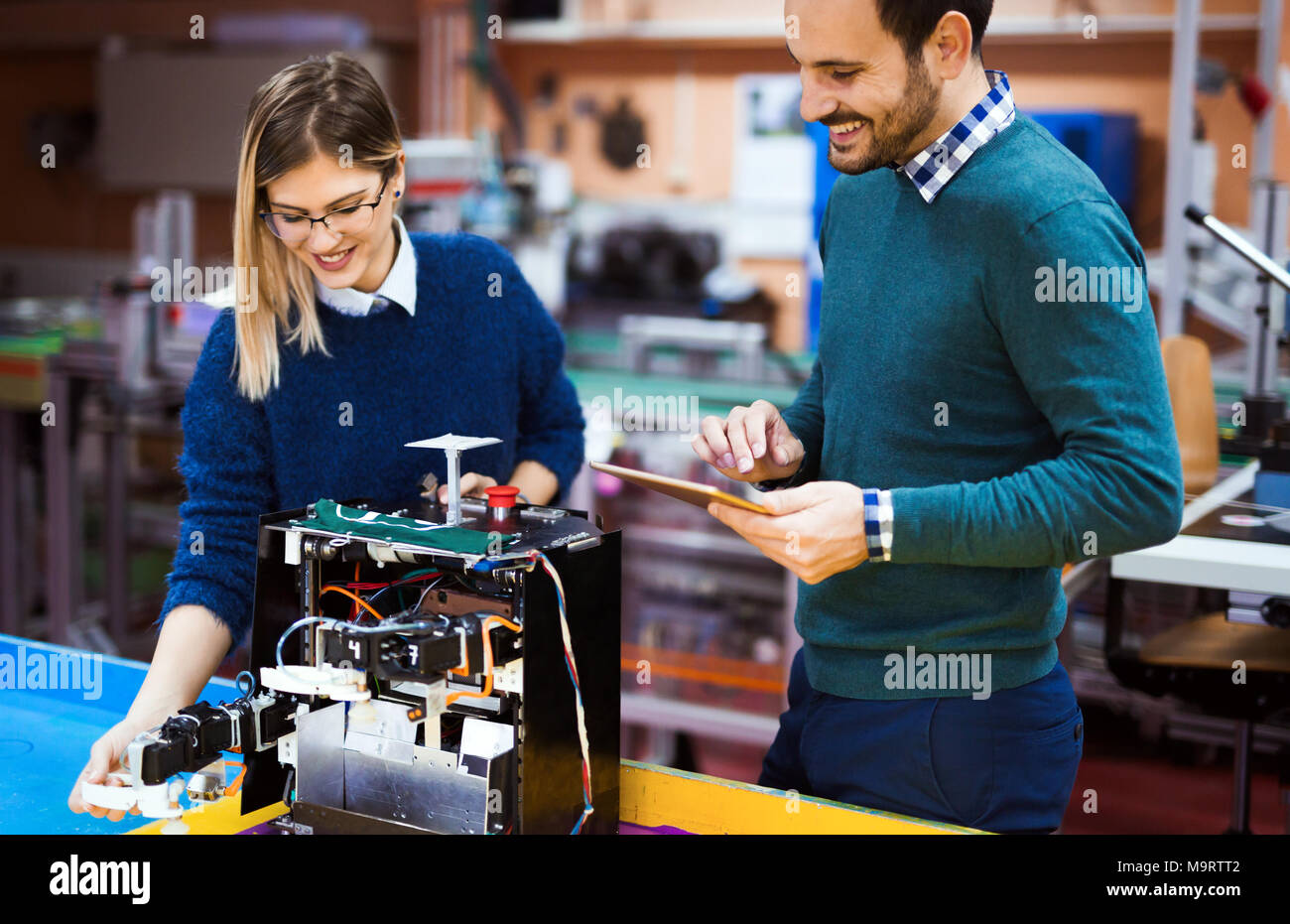 Young students of robotics working on project Stock Photo - Alamy