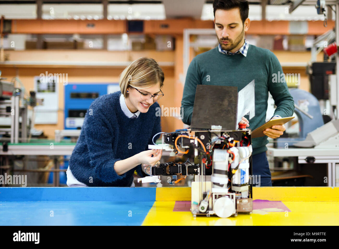 Young students of robotics working on project Stock Photo - Alamy