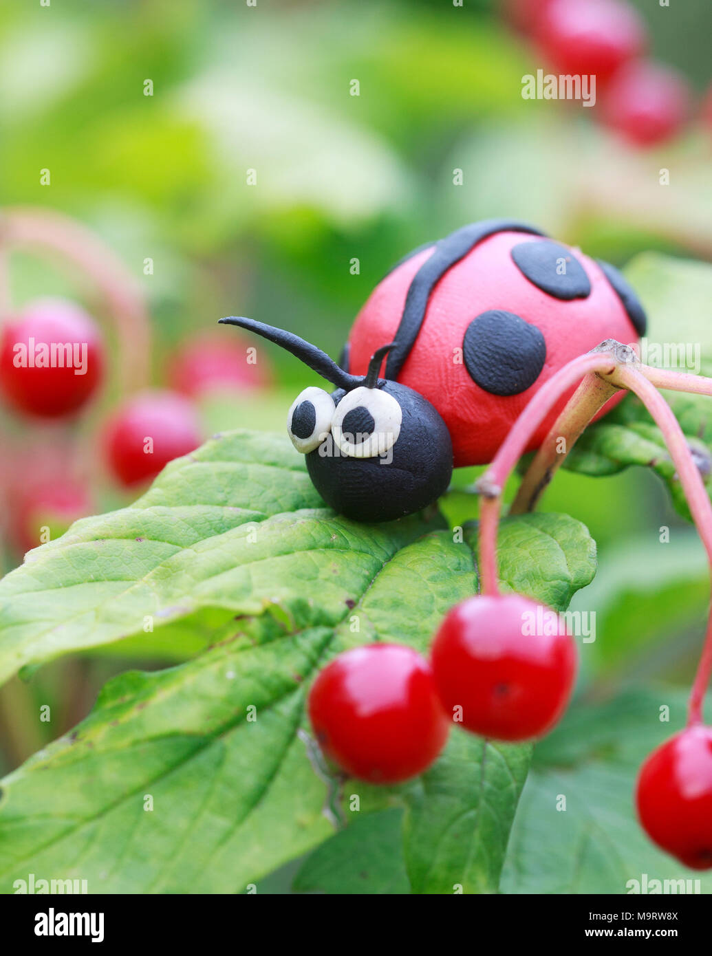 Plasticine world - little homemade red ladybird sitting on a leaf ...