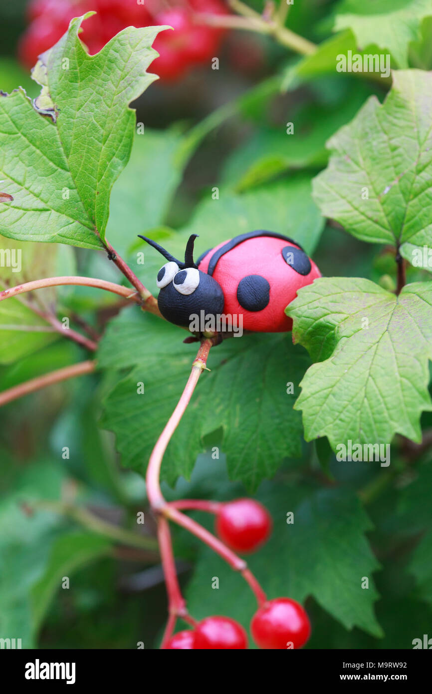 Plasticine world - little homemade red ladybird sitting on a leaf ...