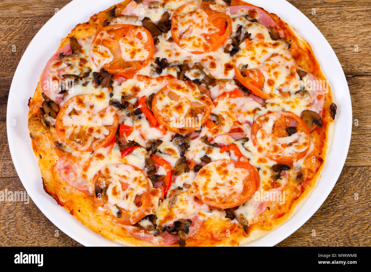 Pizza with ham and cheese Stock Photo - Alamy