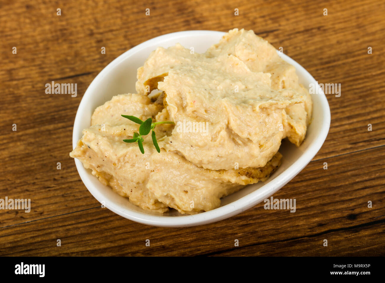 Vegetarian Humus with sesame seeds and thyme leaves Stock Photo - Alamy