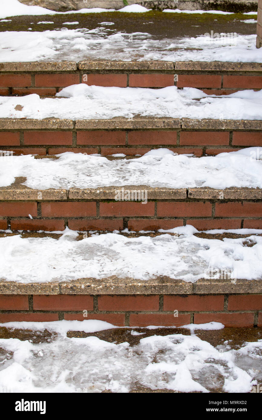 Compacted snow that has frozen on steps during freezing weather UK ...