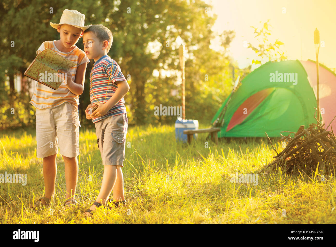 children on a camping trip learning how to read and use a map Stock ...