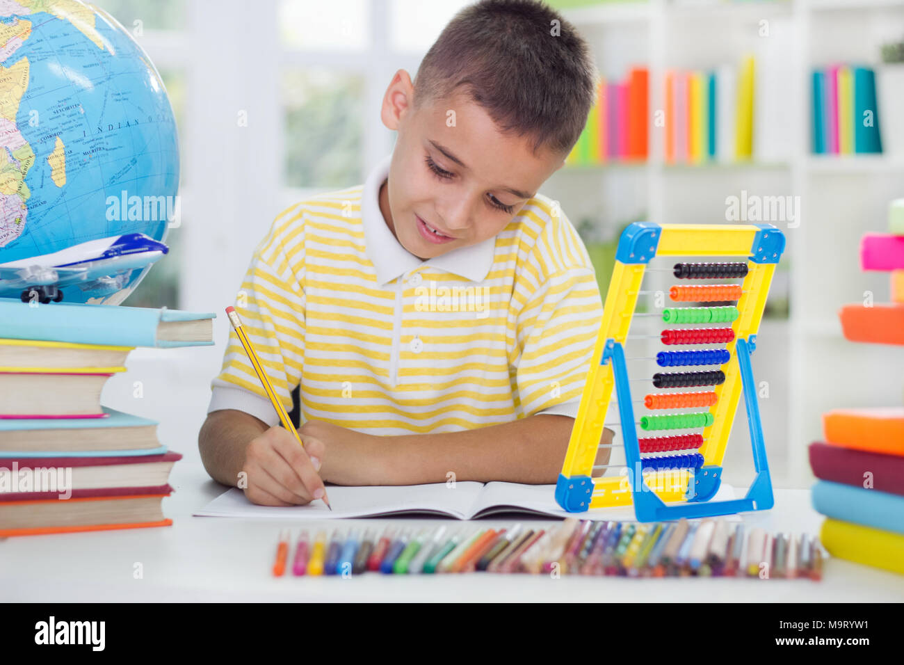 young boy learning at home Stock Photo - Alamy