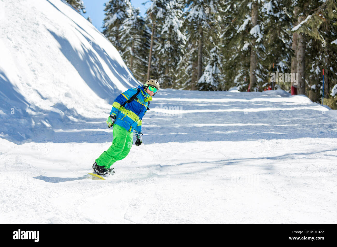 Image of man riding snowboard from snowy hill Stock Photo - Alamy