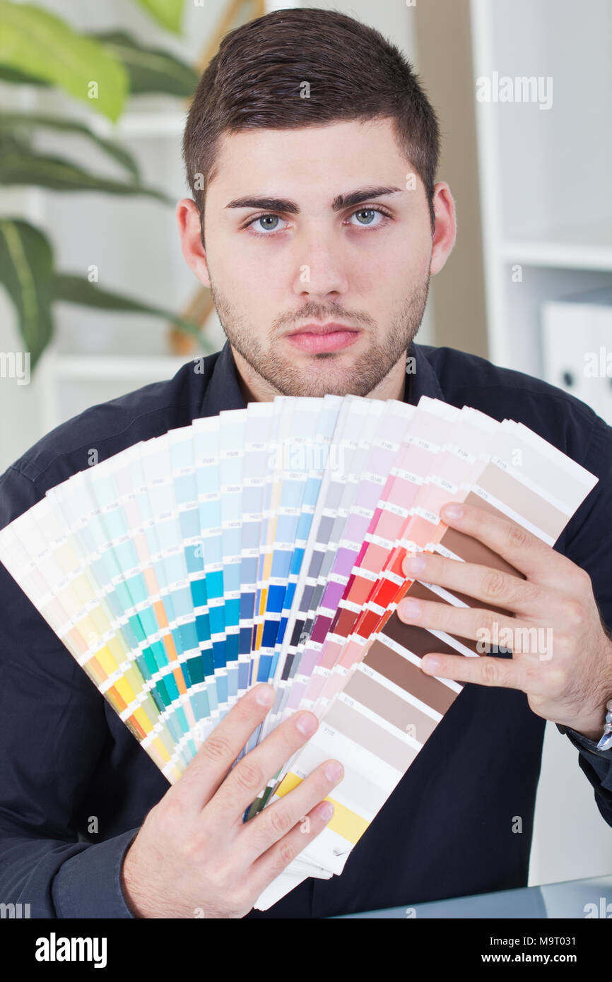 successful businessman showing color palettes Stock Photo - Alamy
