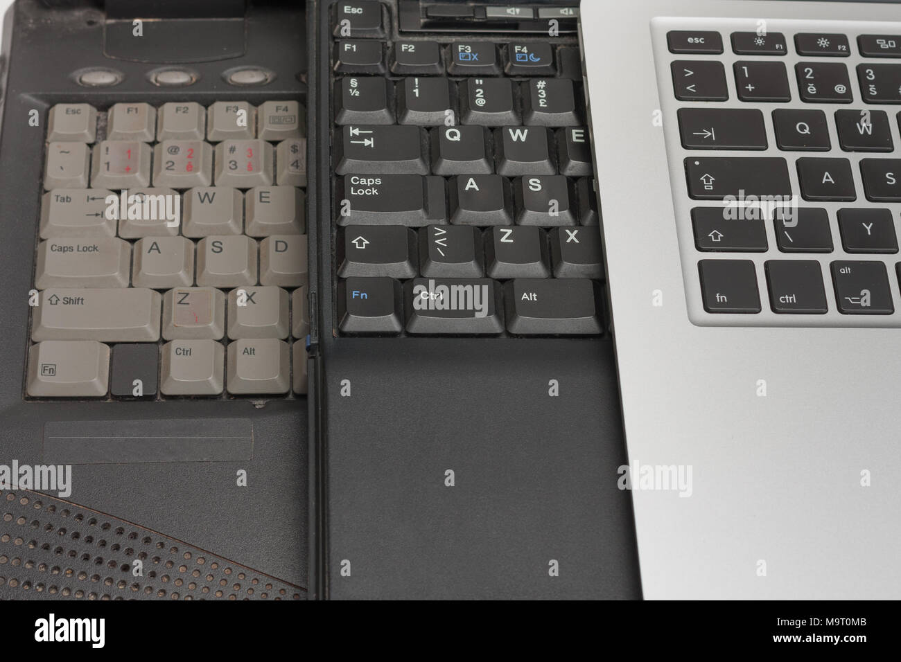 Comparing of laptops, new modern and old laptops, present and past ...