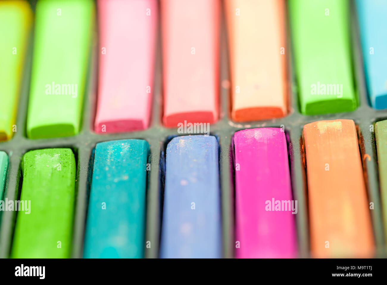 Close up Colorful chalks in a variety of colors arranged in tray Stock ...