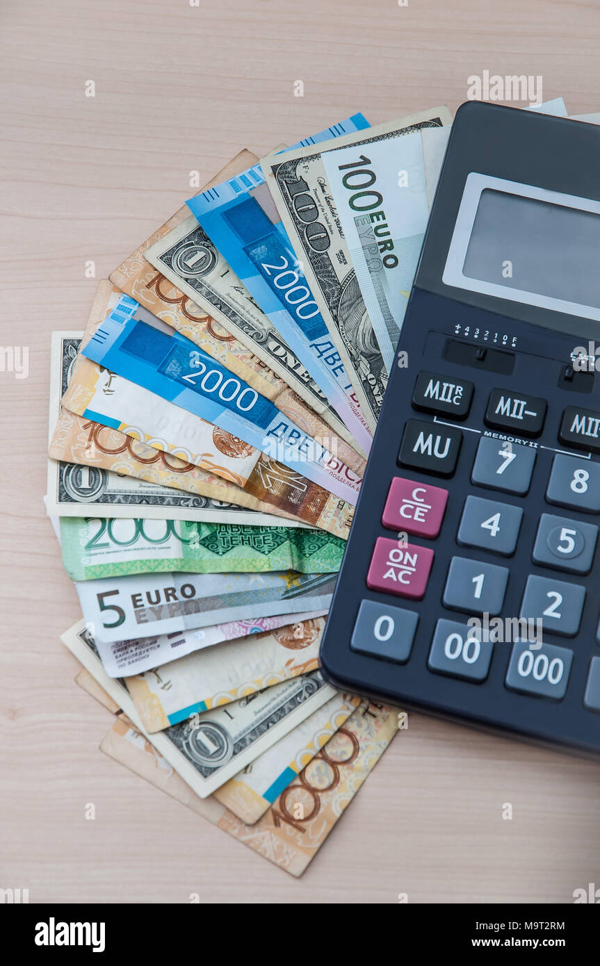 Different banknotes of different denominations are stacked in a fan and ...