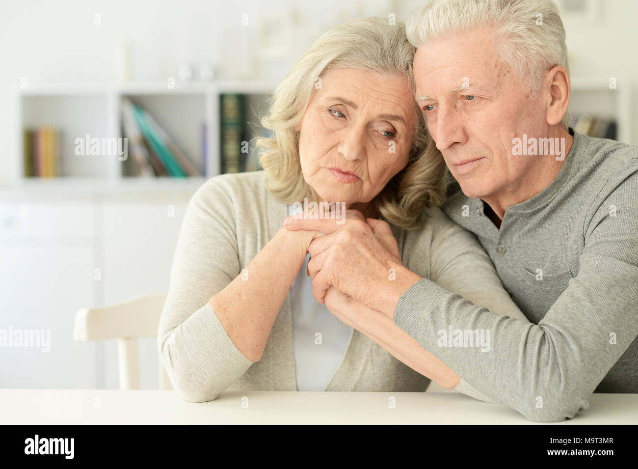 Portrait of a sad senior couple posing Stock Photo - Alamy