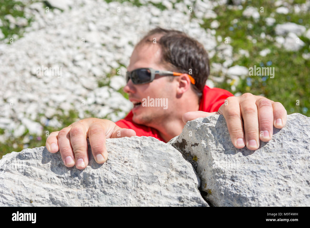 Hanging from ledge hi-res stock photography and images - Alamy