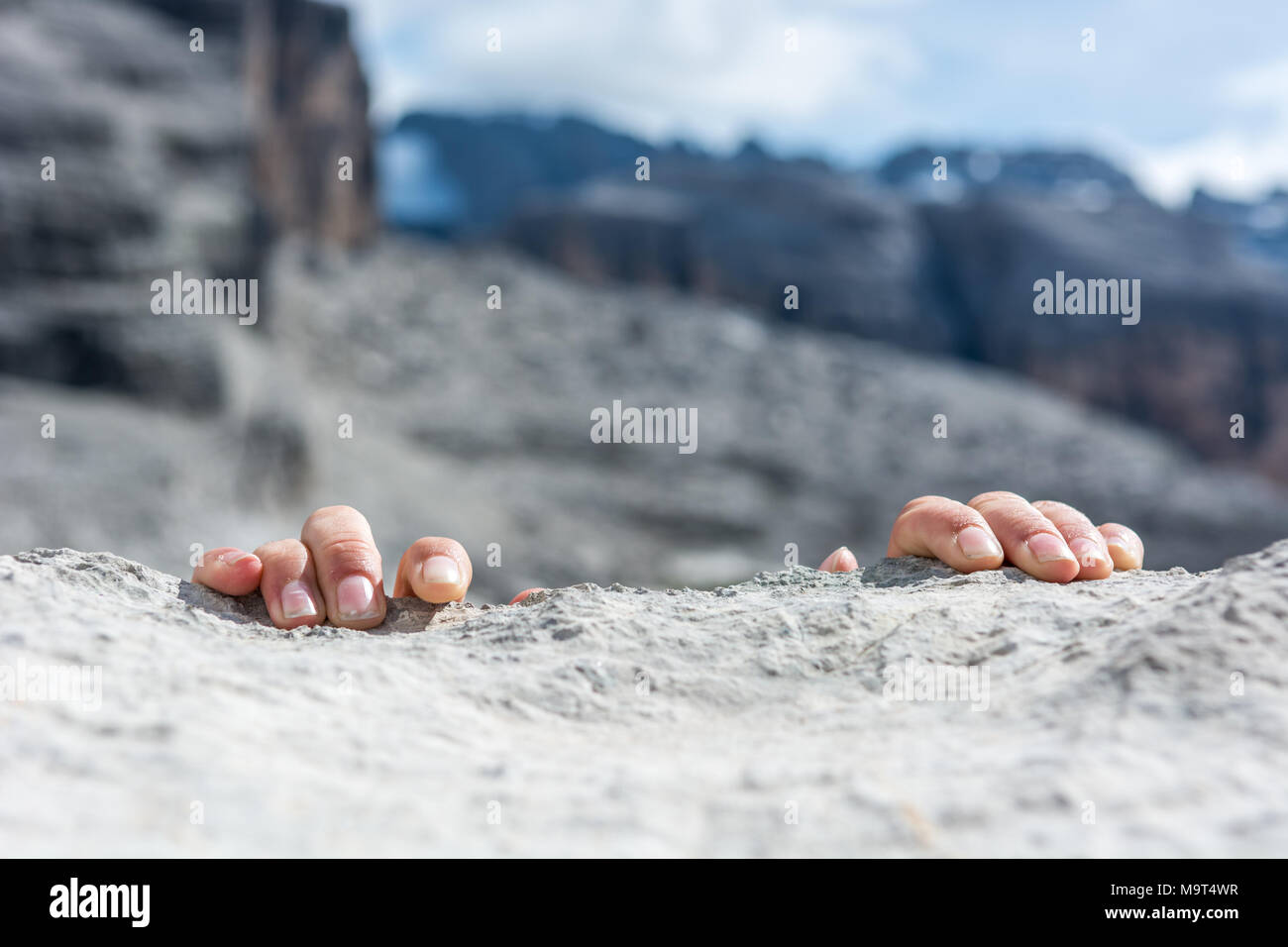 Closeup of fingers gripping a rock Stock Photo - Alamy