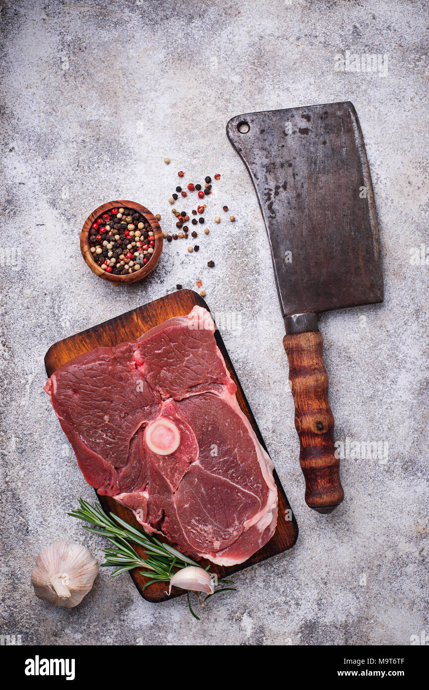 Lamb meat with rosemary, spices and cleaver Stock Photo - Alamy