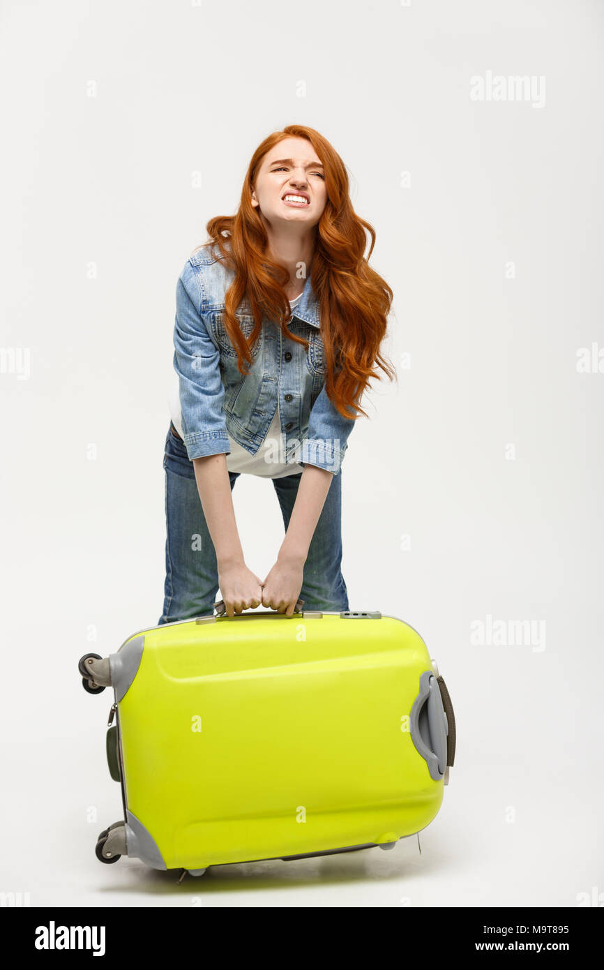 Lifting heavy suitcase hi-res stock photography and images - Alamy