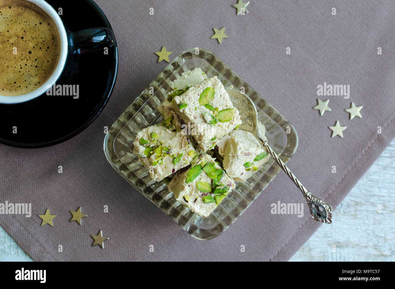 Traditional eastern dessert - halva pistachio and cup of coffee ...