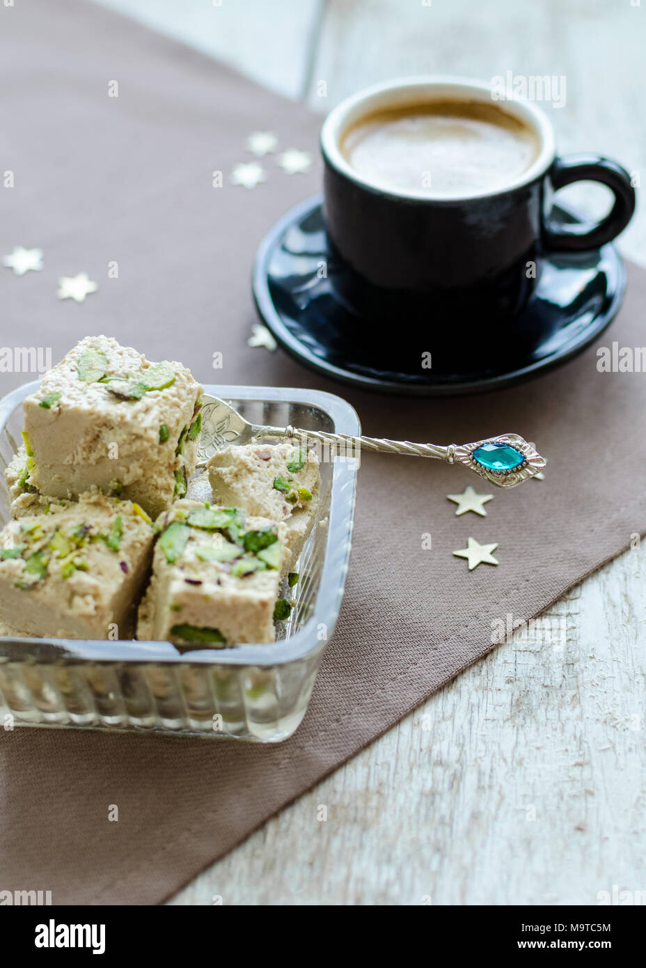 Traditional eastern dessert - halva pistachio and cup of coffee ...