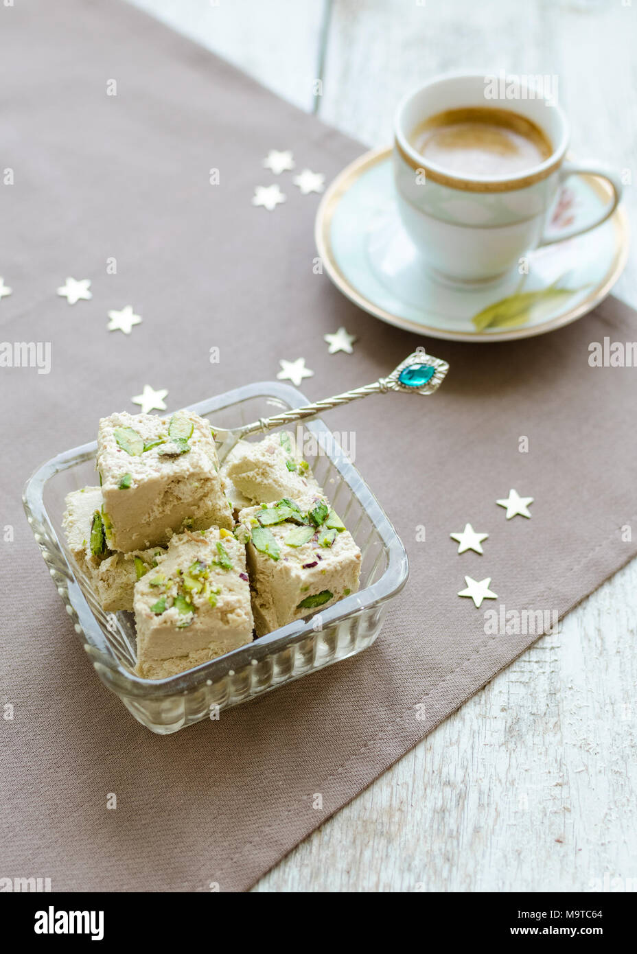 Traditional eastern dessert - halva pistachio and cup of coffee ...