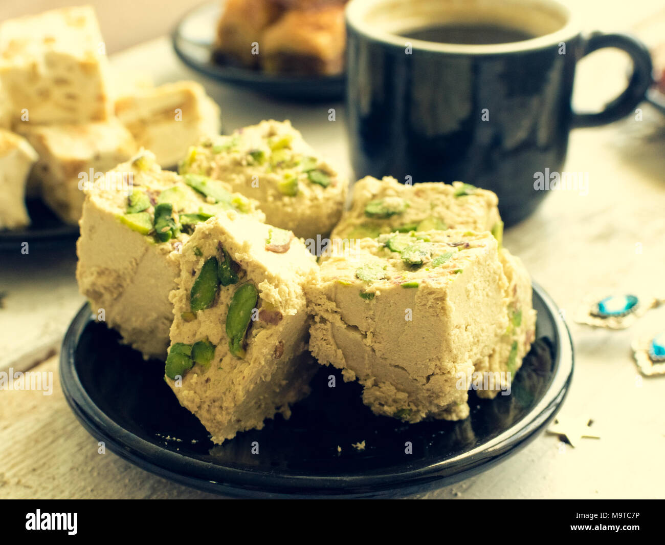 Traditional eastern dessert - halva pistachio and cup of coffee ...