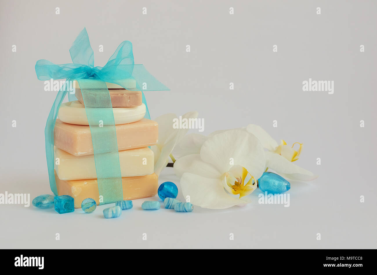 Spa setting in pastel and blue colors with different kind of natural ...