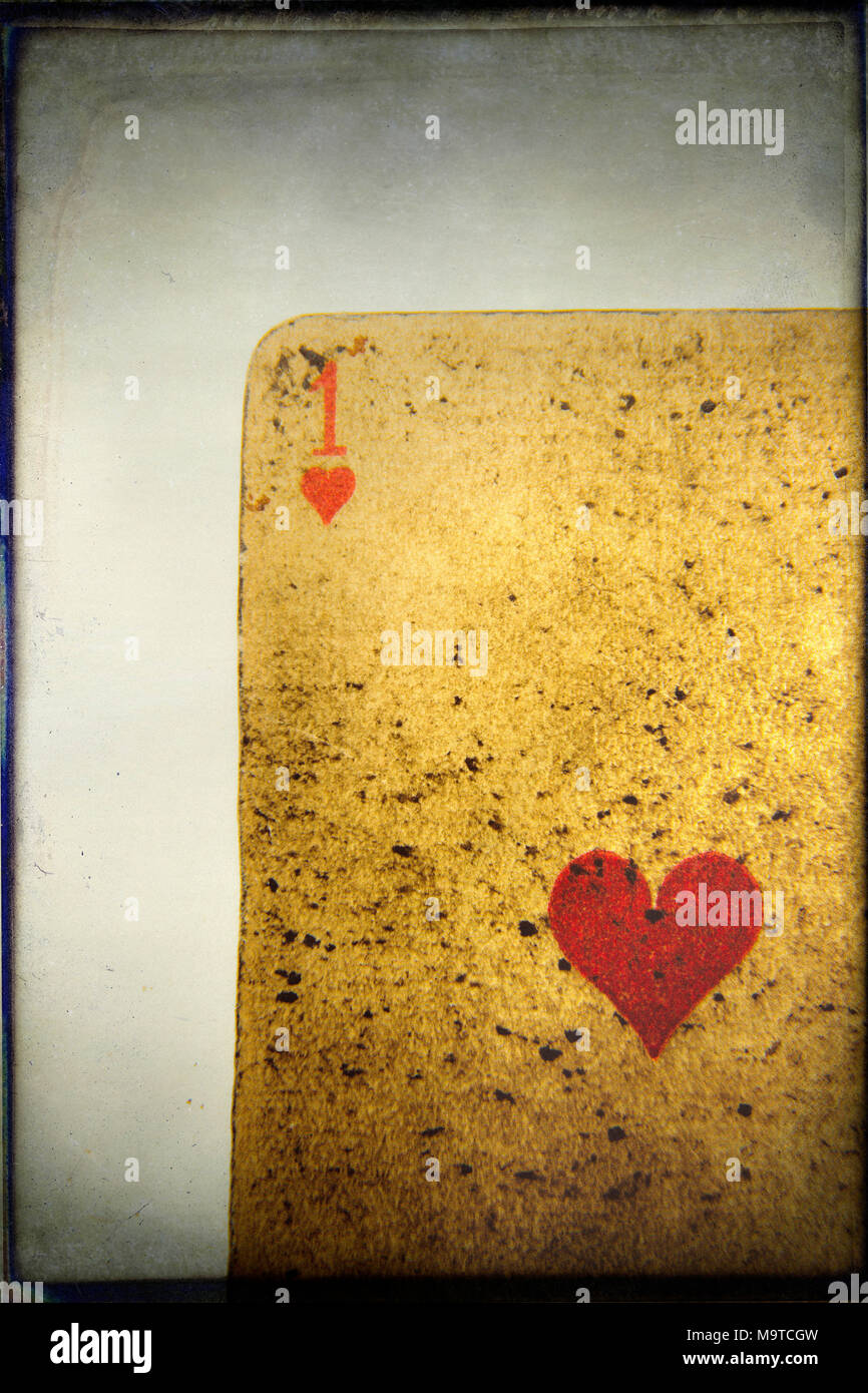 Vertical closeup shot of a worn-out playing card of hearts - perfect ...