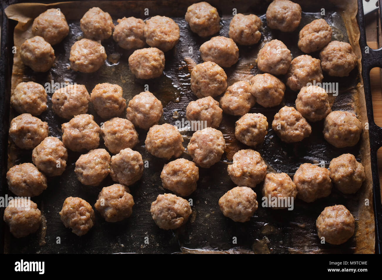Baked meatballs on tray Stock Photo - Alamy