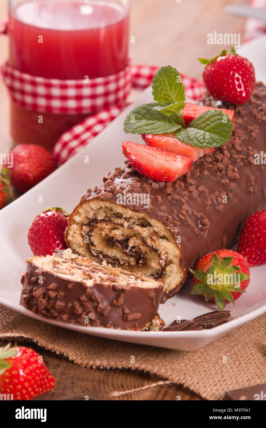 Chocolate roll with strawberries Stock Photo - Alamy