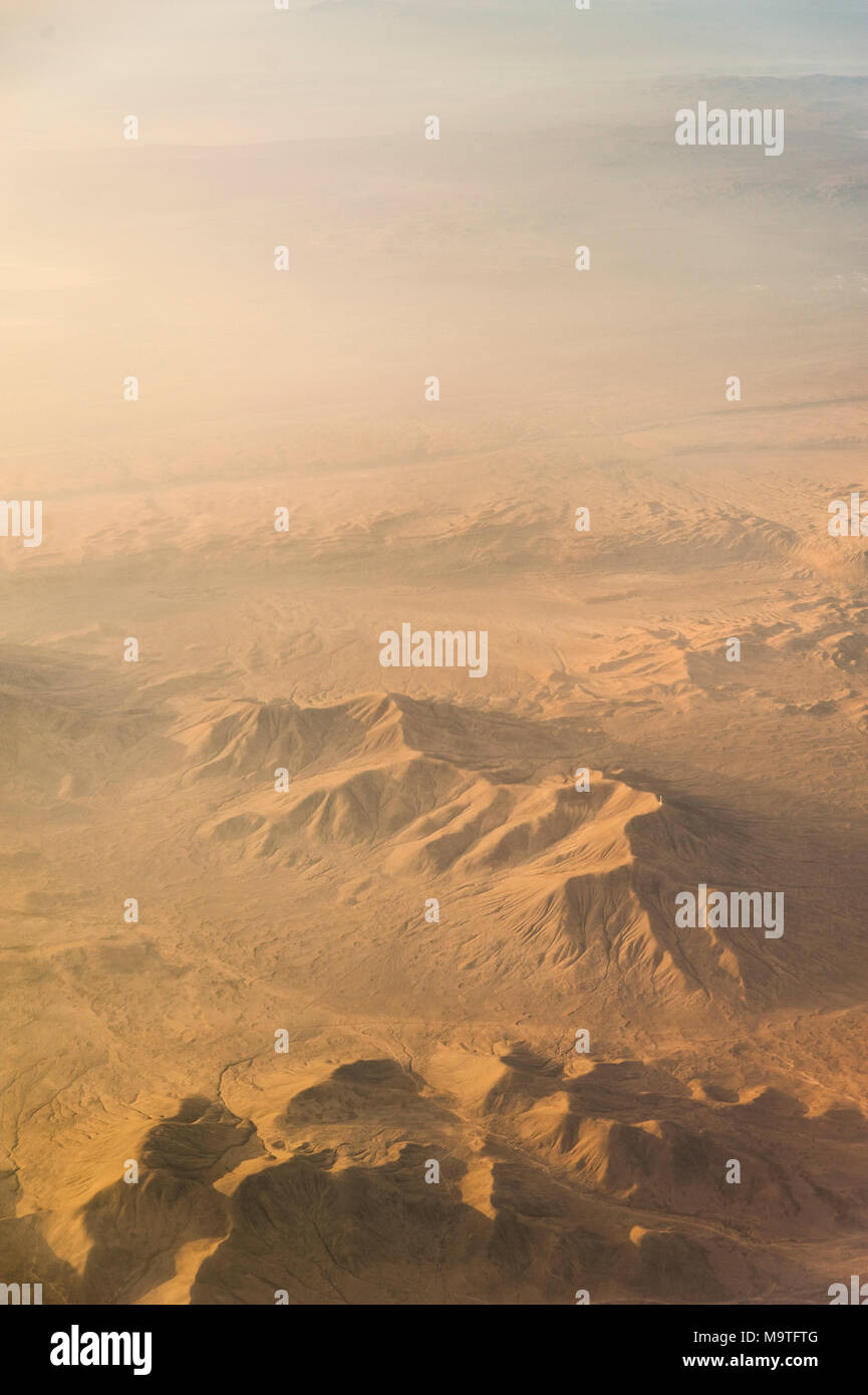 Airplane aerial window view over Atacama desert during sunrise, Chile ...