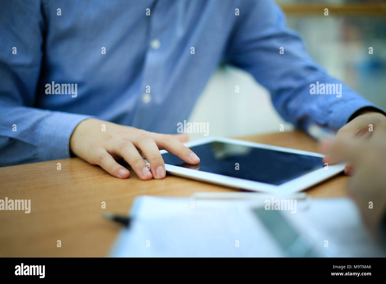 close up hands multitasking man using tablet, laptop connecting wifi ...