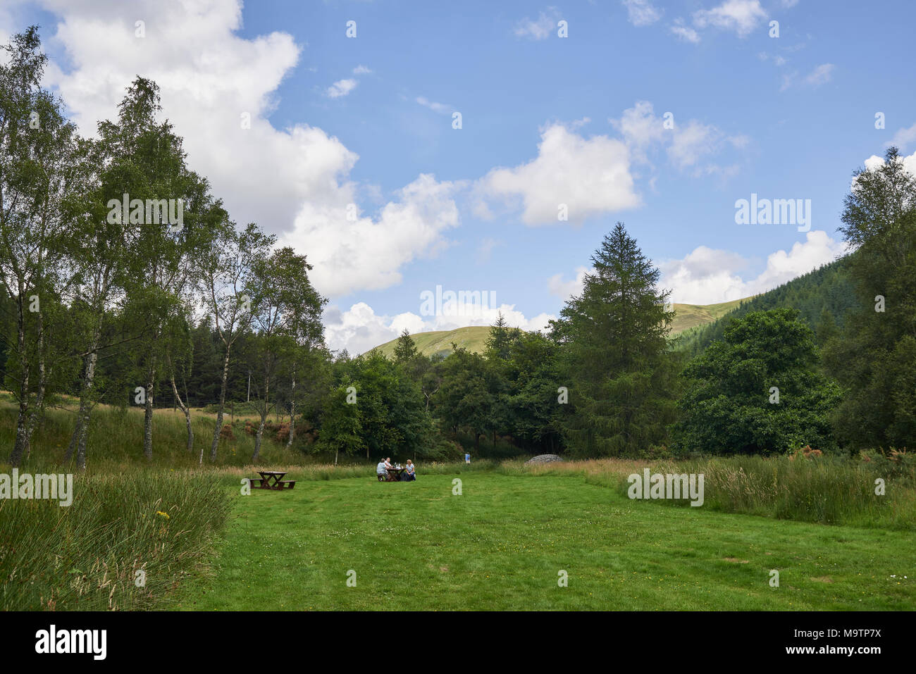 People enjoying a picnic in the Scottish Countryside at Glen Doll ...