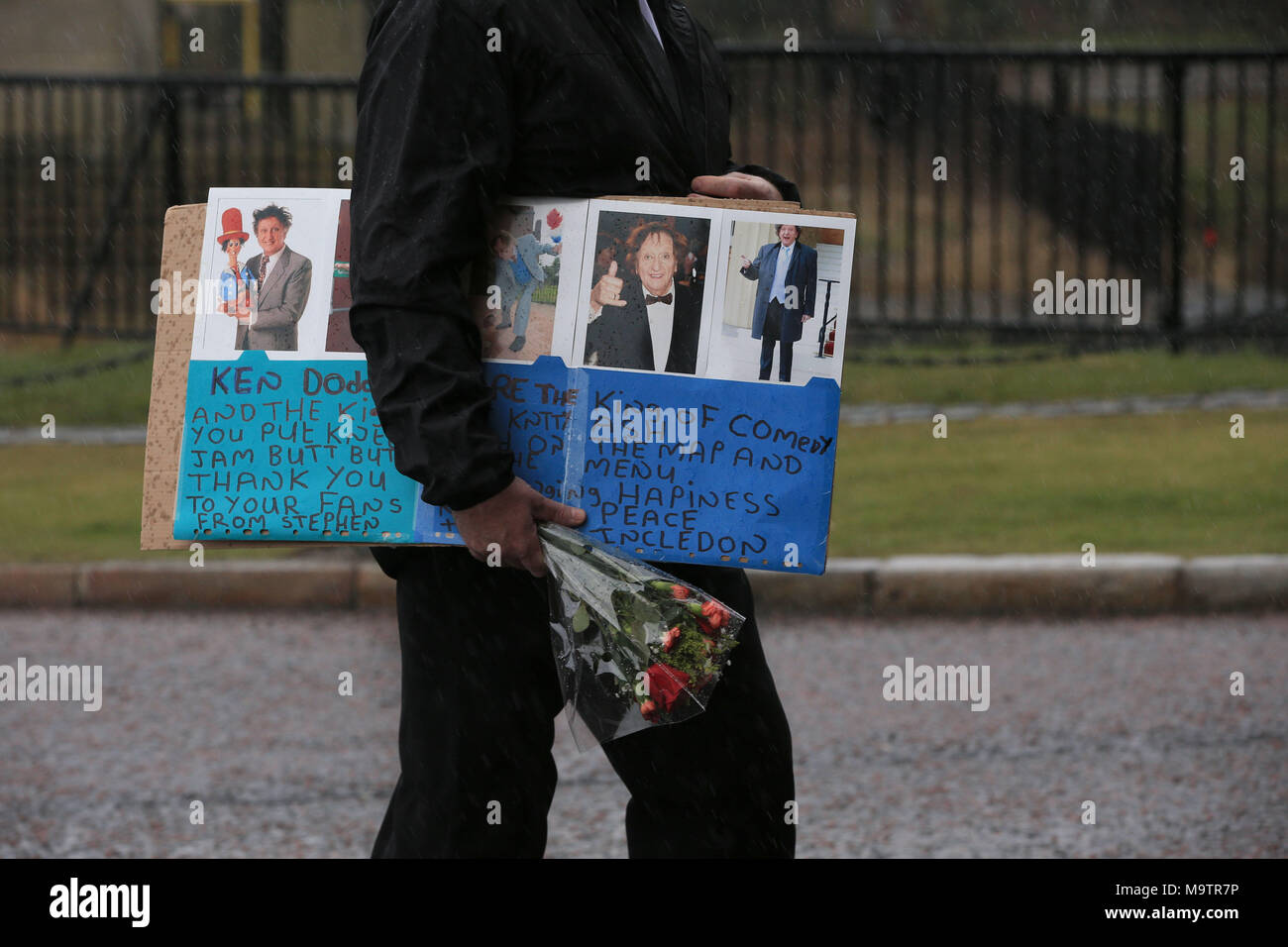 A fan of Sir Ken Dodd arrives ahead of the comedian's funeral service ...