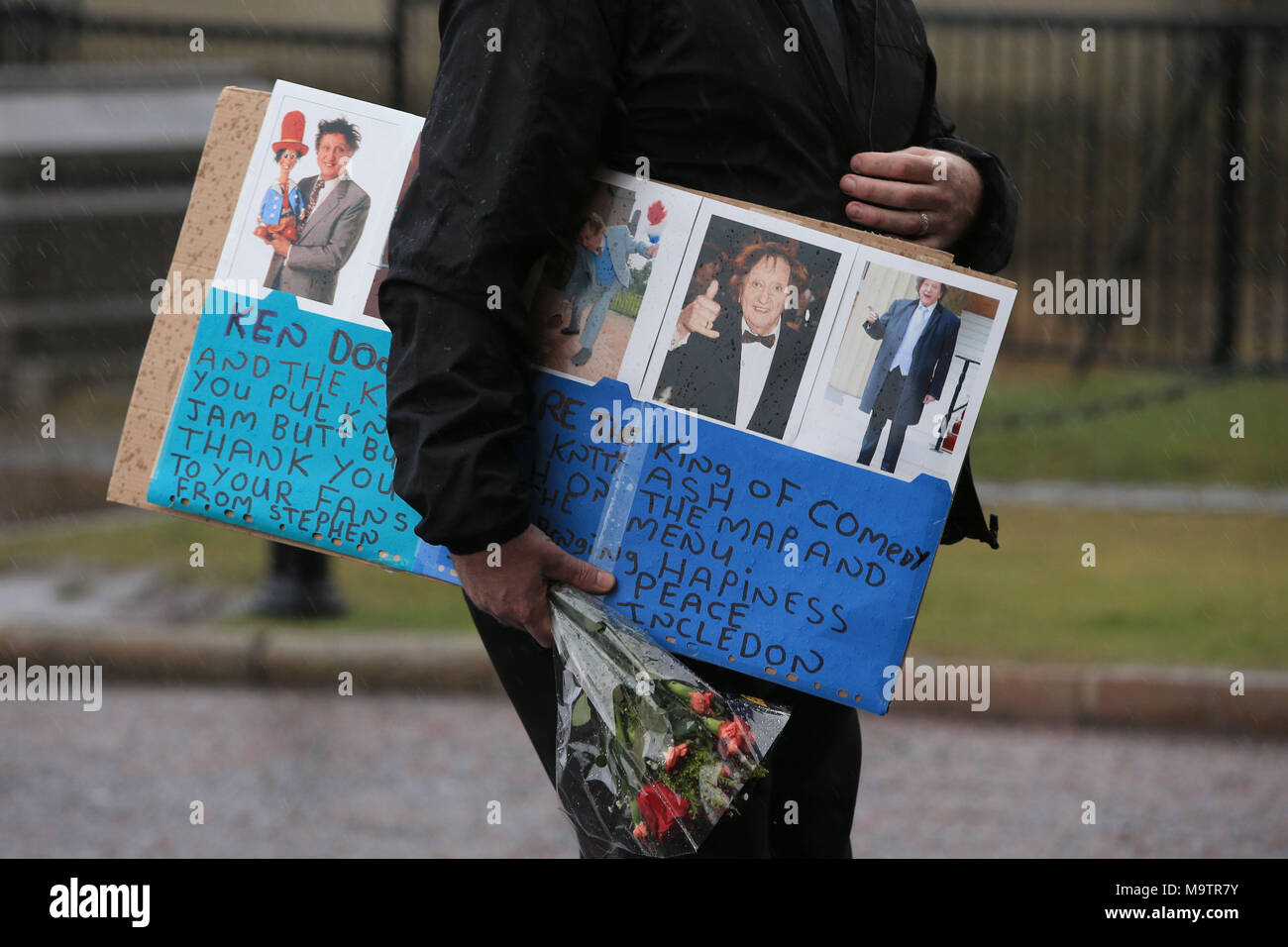 A fan of Sir Ken Dodd arrives ahead of the comedian's funeral service ...