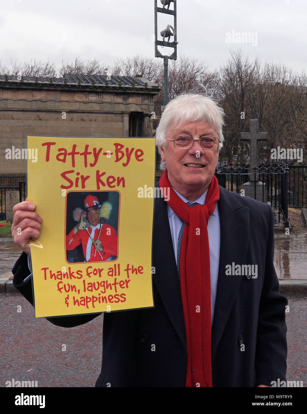 A fan of Sir Ken Dodd holds up a tribute ahead of the comedian's ...
