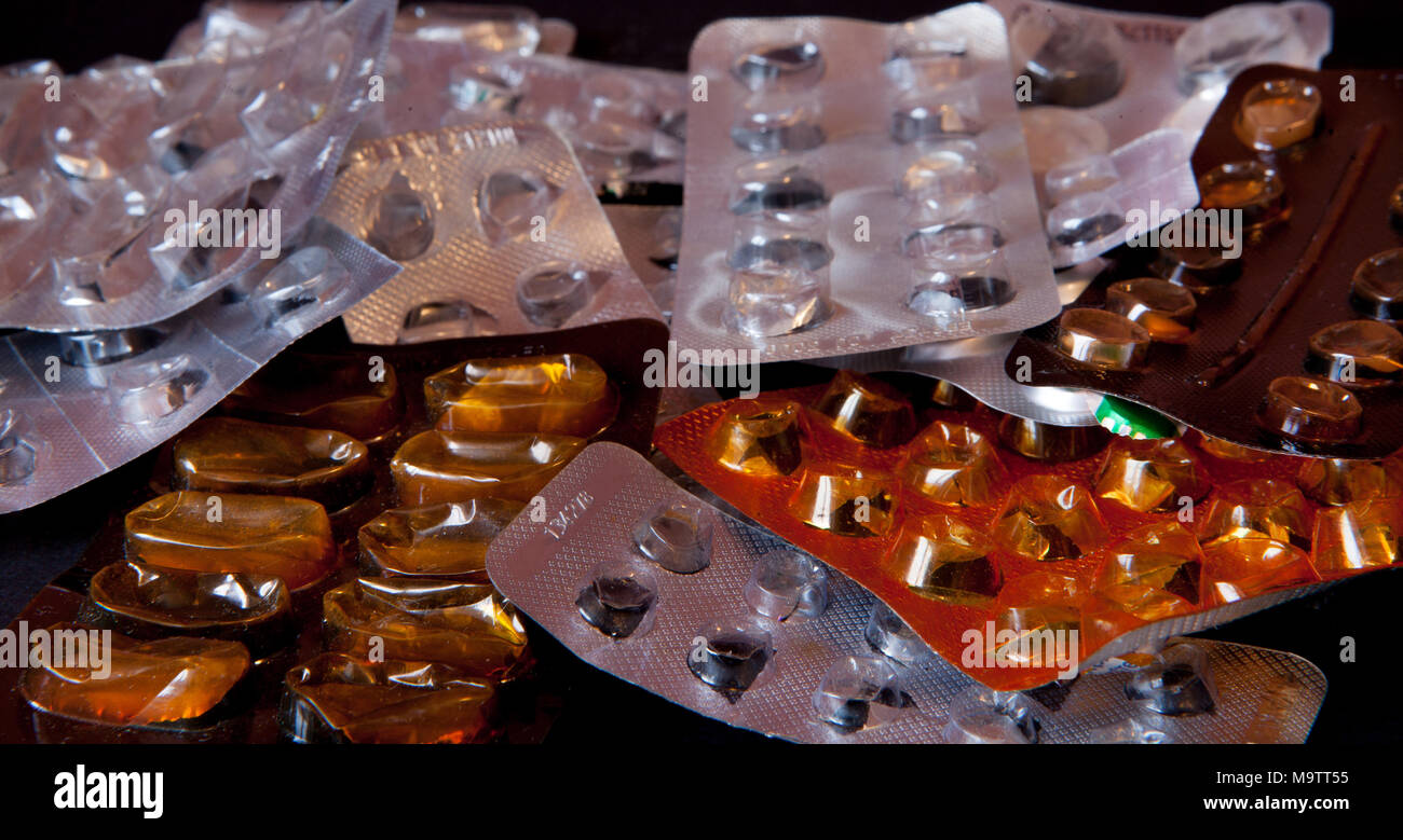 blank plate of pills on a black background, background with hollow ...